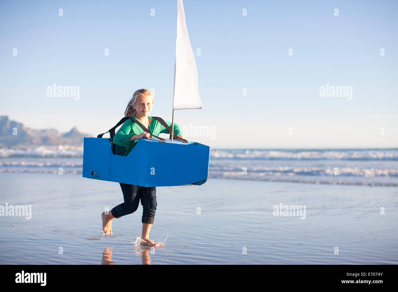 Child holding toy boat hi-res stock photography and images - Alamy