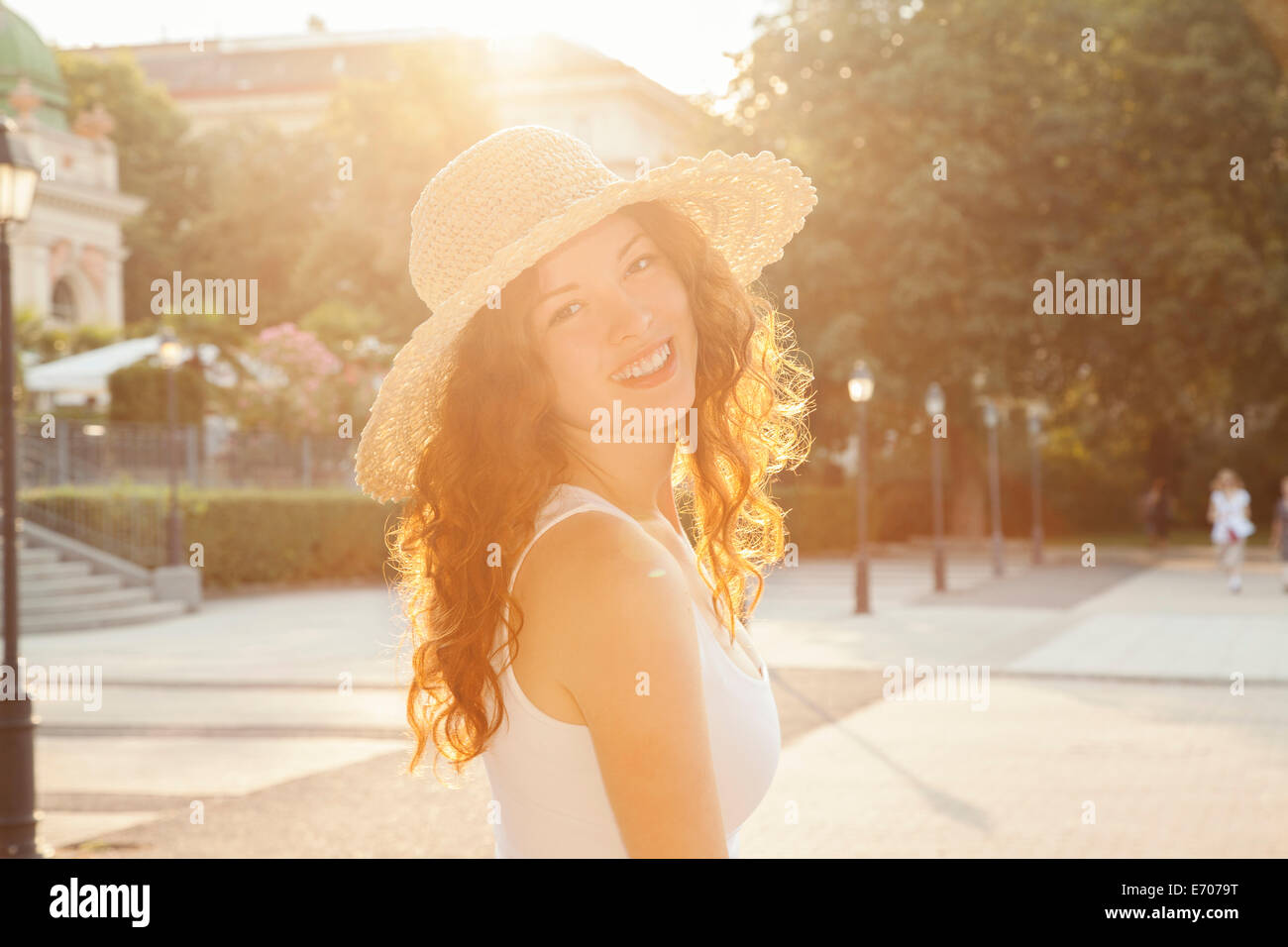 Women smiling looking over shoulder hi-res stock photography and images ...