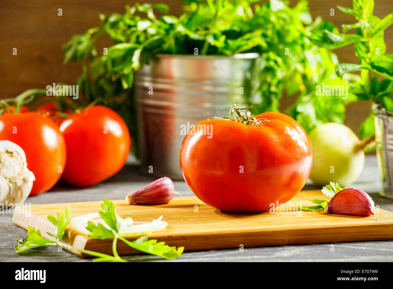 Fresh tomato and vegetables arranged on a wooden table Stock Photo - Alamy