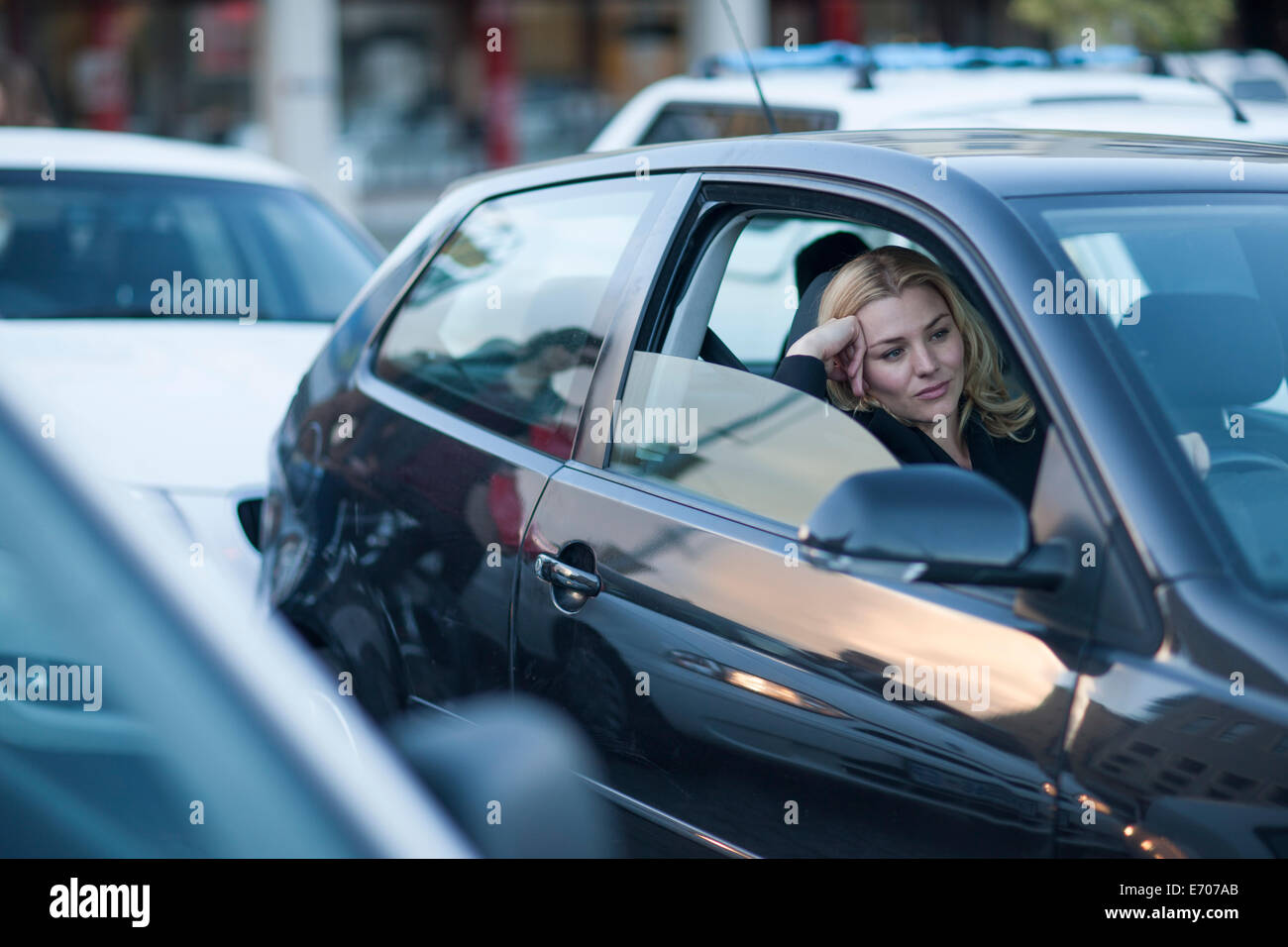 Bored businesswoman driving in city traffic jam Stock Photo - Alamy