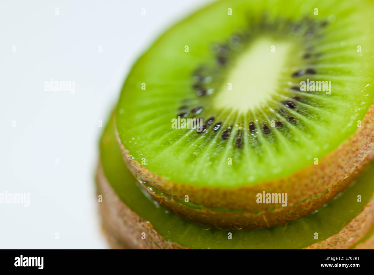 kiwi on paper background Stock Photo - Alamy