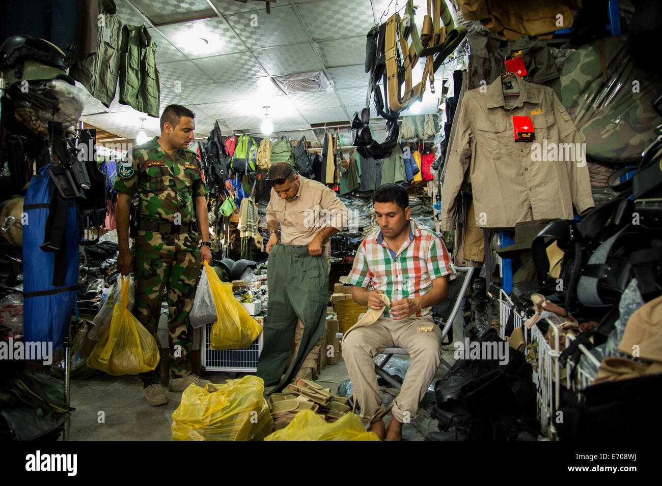 Erbil, Iraq. 1st Sep, 2014. Kurdish Peshmerga fighters buy miitary ...