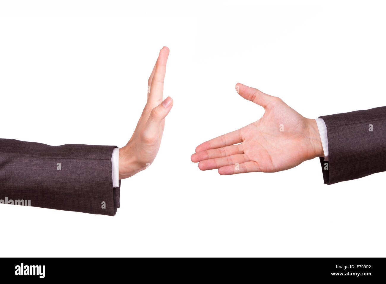 Businessman hands, one of reaching for handshake, the other gesturing ...