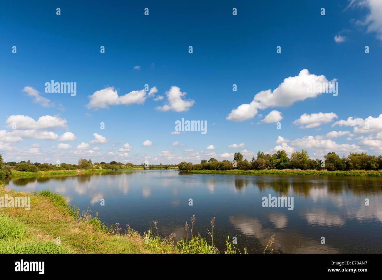 River with reflection of clouds Stock Photo - Alamy