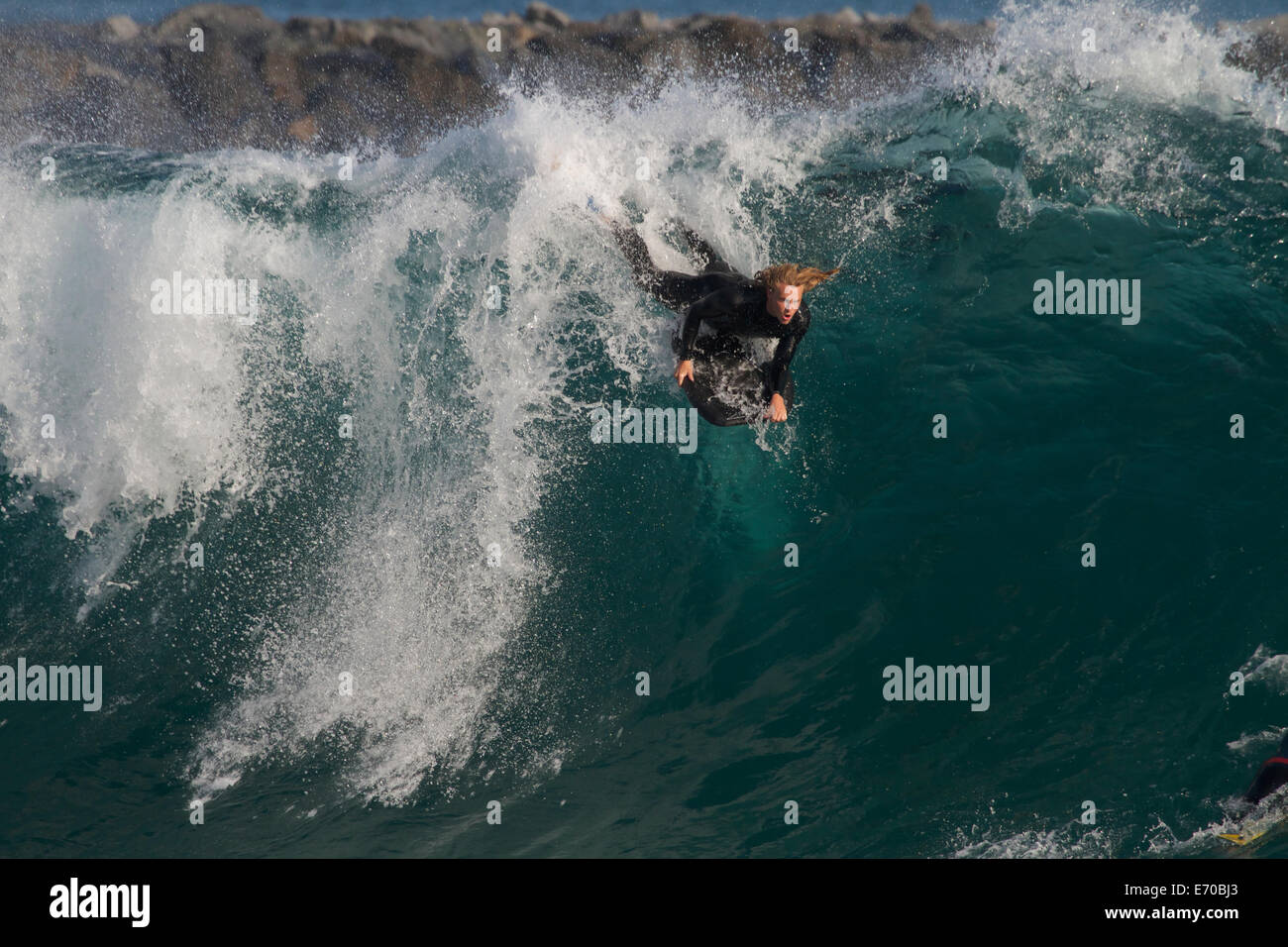 A bodyboarder takes off on a huge wave at the world famous surfing ...