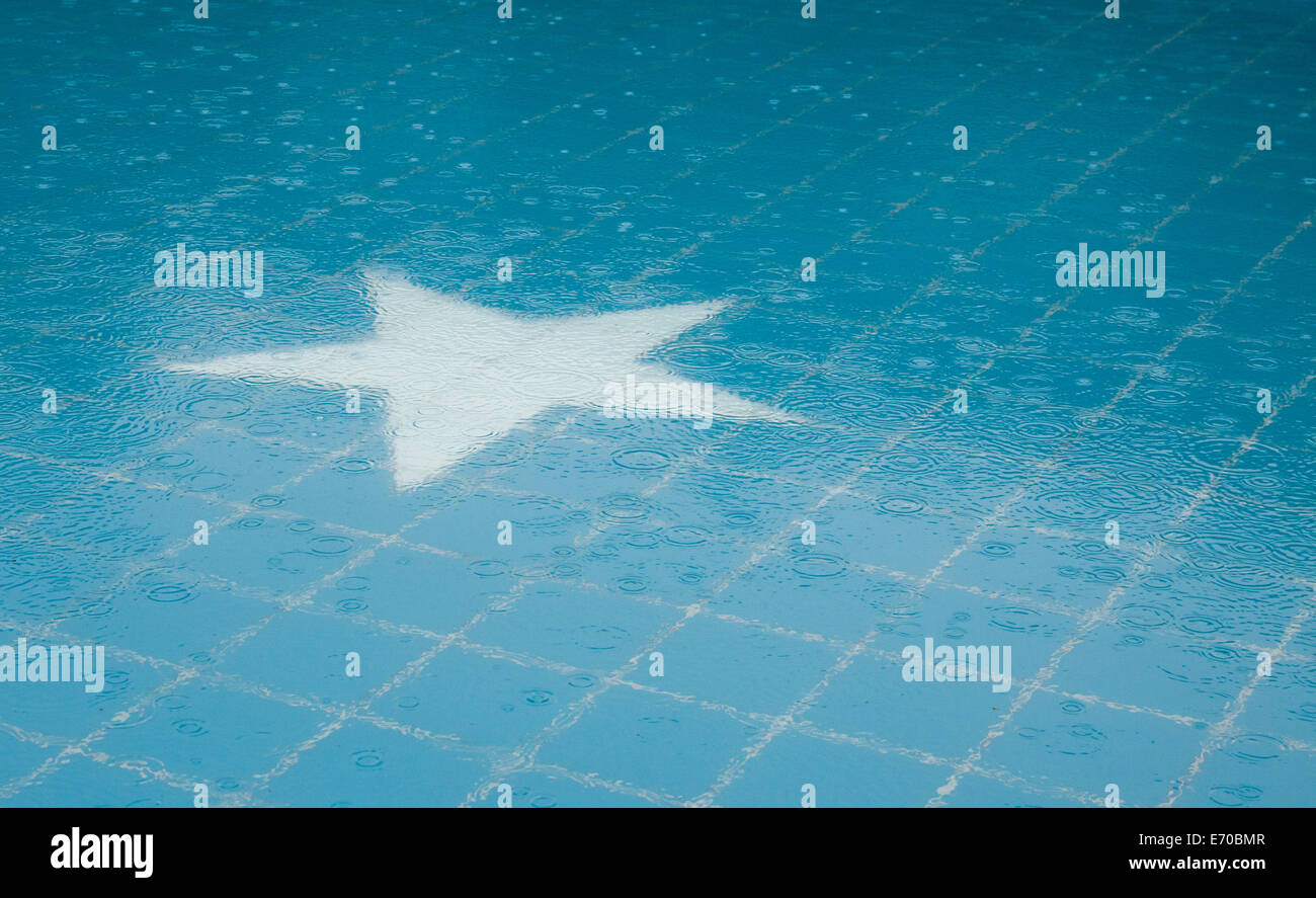 Rain in the pool Stock Photo - Alamy