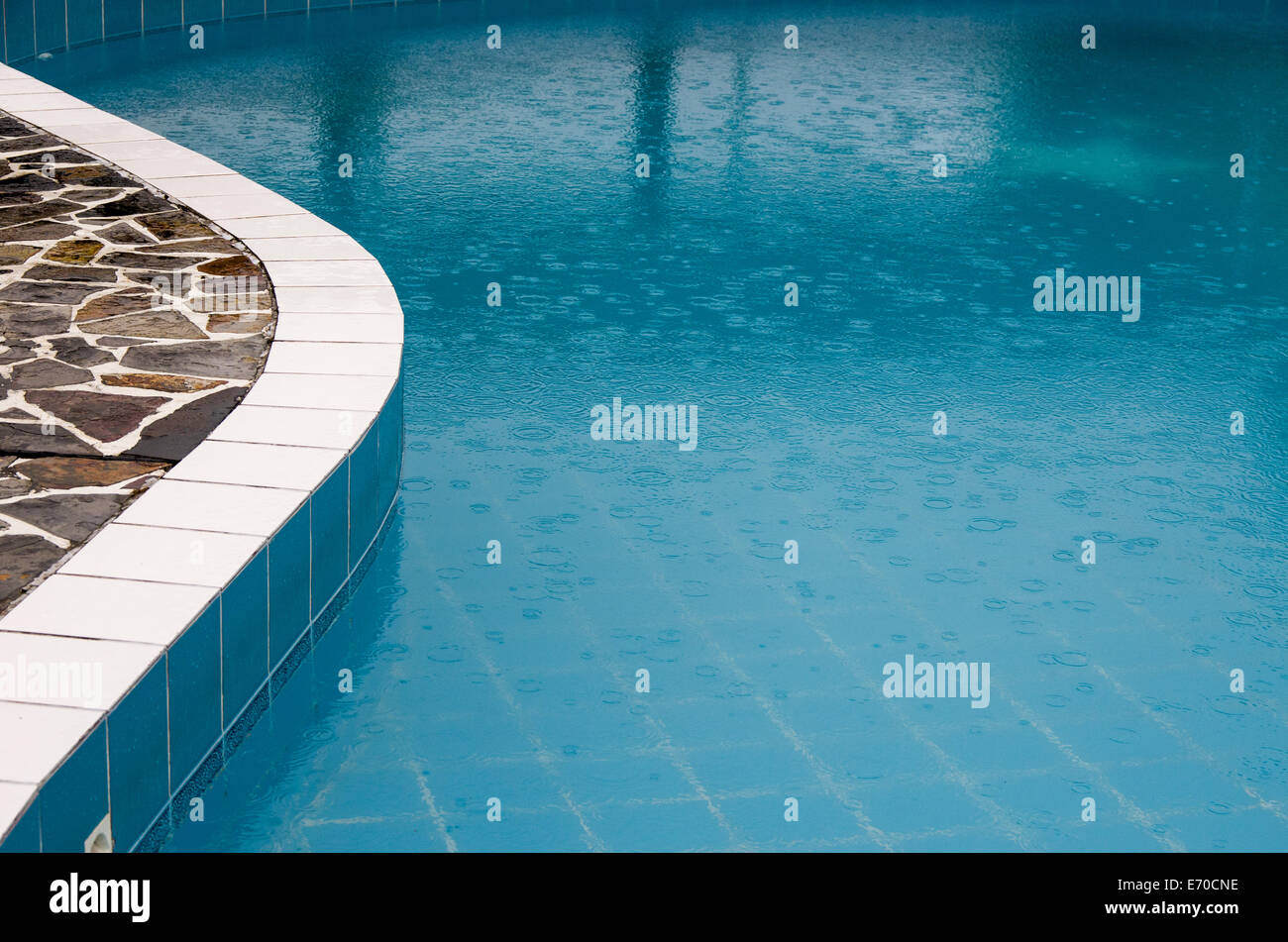 Rain in the pool Stock Photo - Alamy