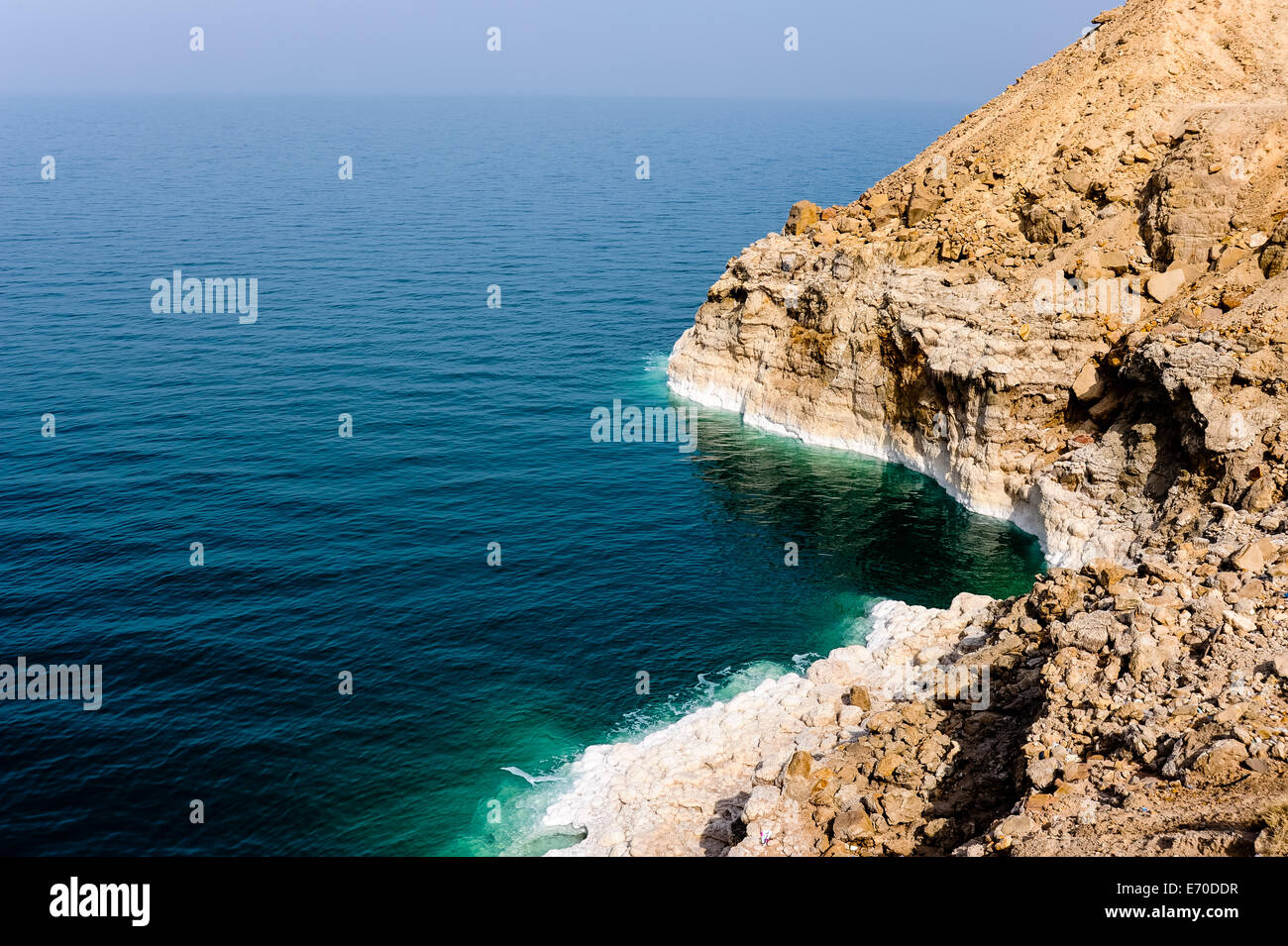 The Dead Sea is a salt lake bordering Jordan to the east and Israel and ...