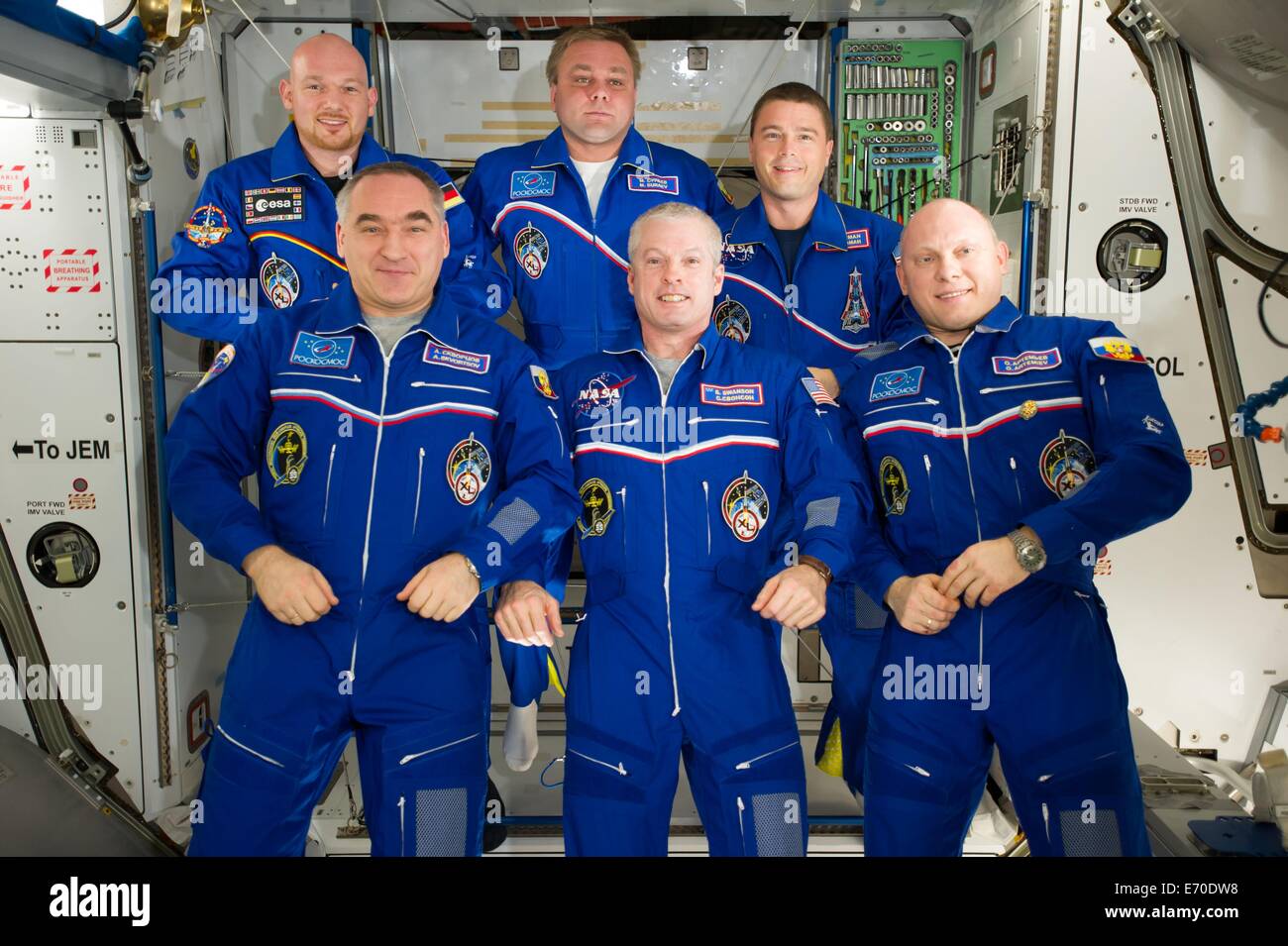 Expedition 40 crew members pose for an in-flight crew portrait in the ...
