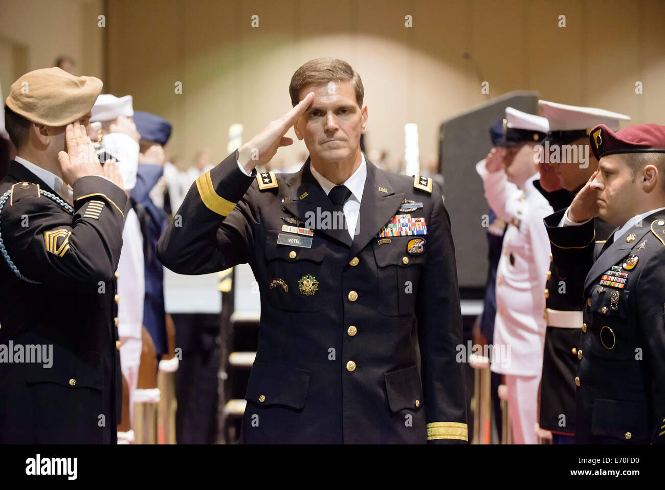US Army Gen. Joseph L. Votel III salutes during his promotion ceremony ...