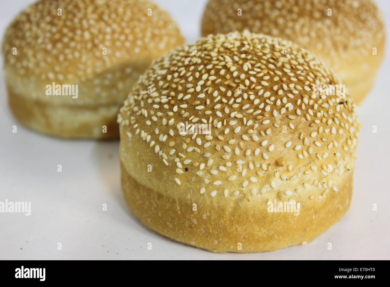 Closeup of Burger Bun on white background Stock Photo - Alamy