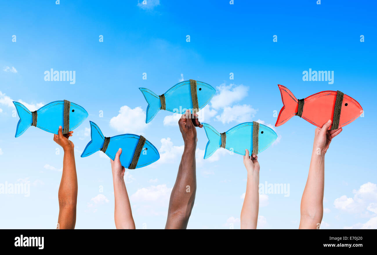 People Holding Fish Symbols and Leadership Concept Stock Photo - Alamy