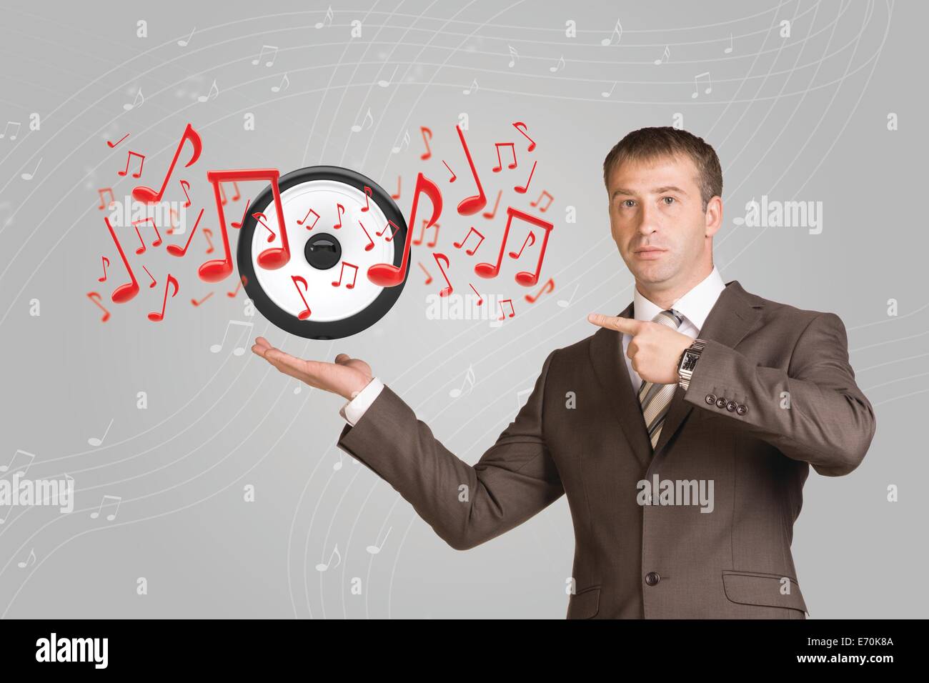 Business man hold audio speaker and music notes in hand Stock Photo - Alamy