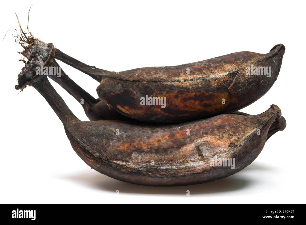 black overripe bananas on a white background Stock Photo - Alamy