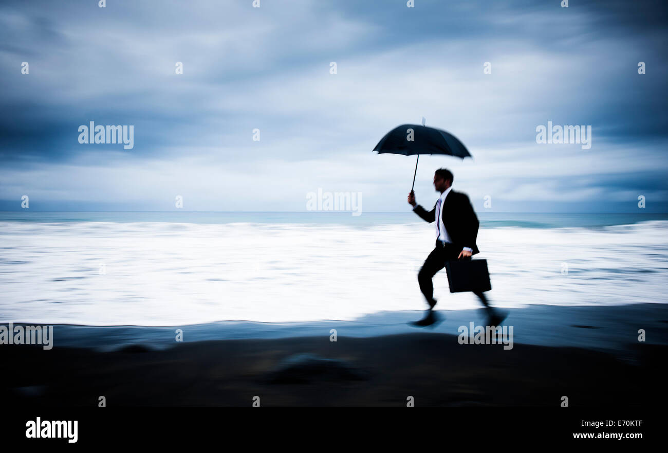 One man running with umbrella hi-res stock photography and images - Alamy