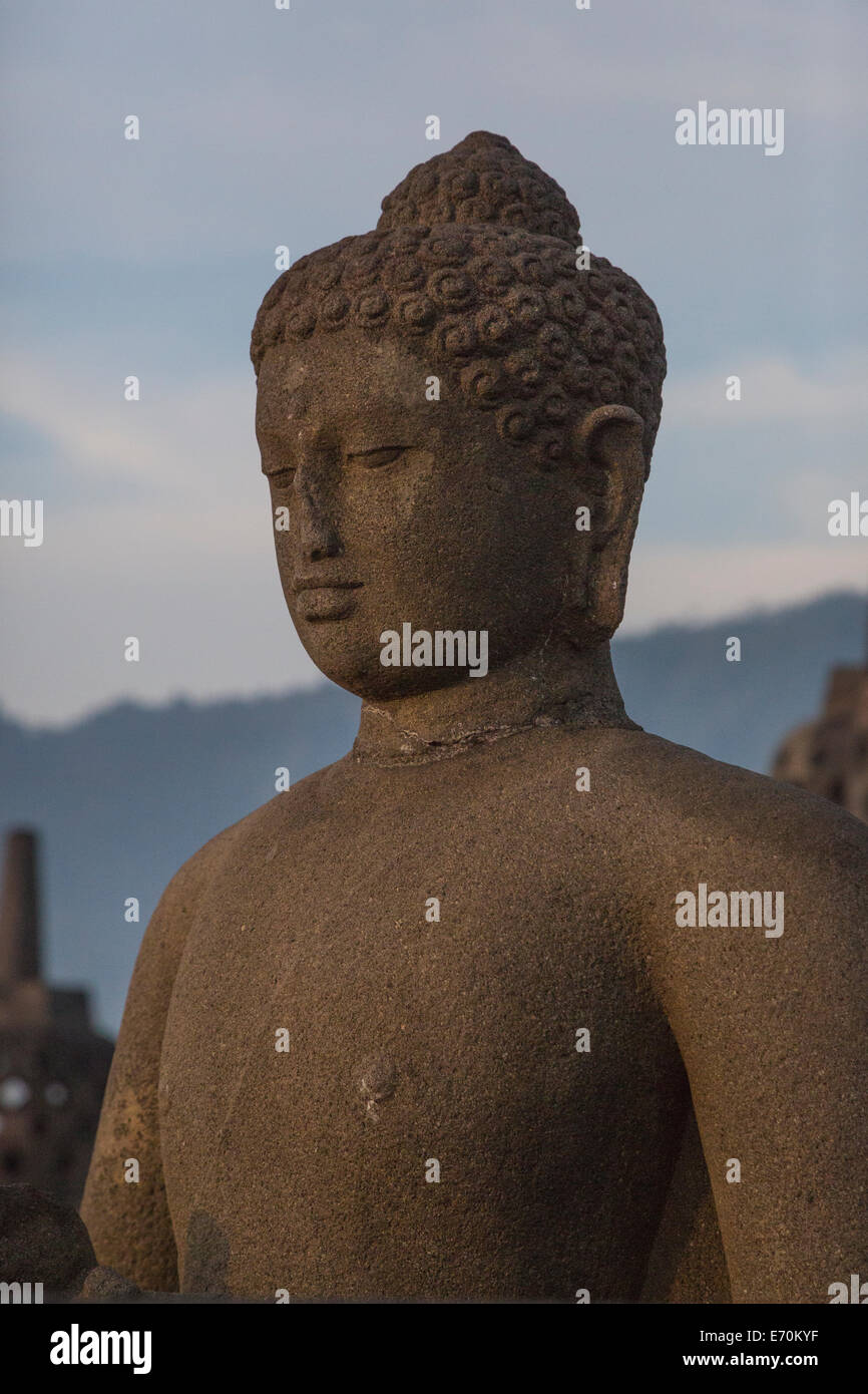 Borobudur, Java, Indonesia. Buddha Statue Receiving First Rays of the ...