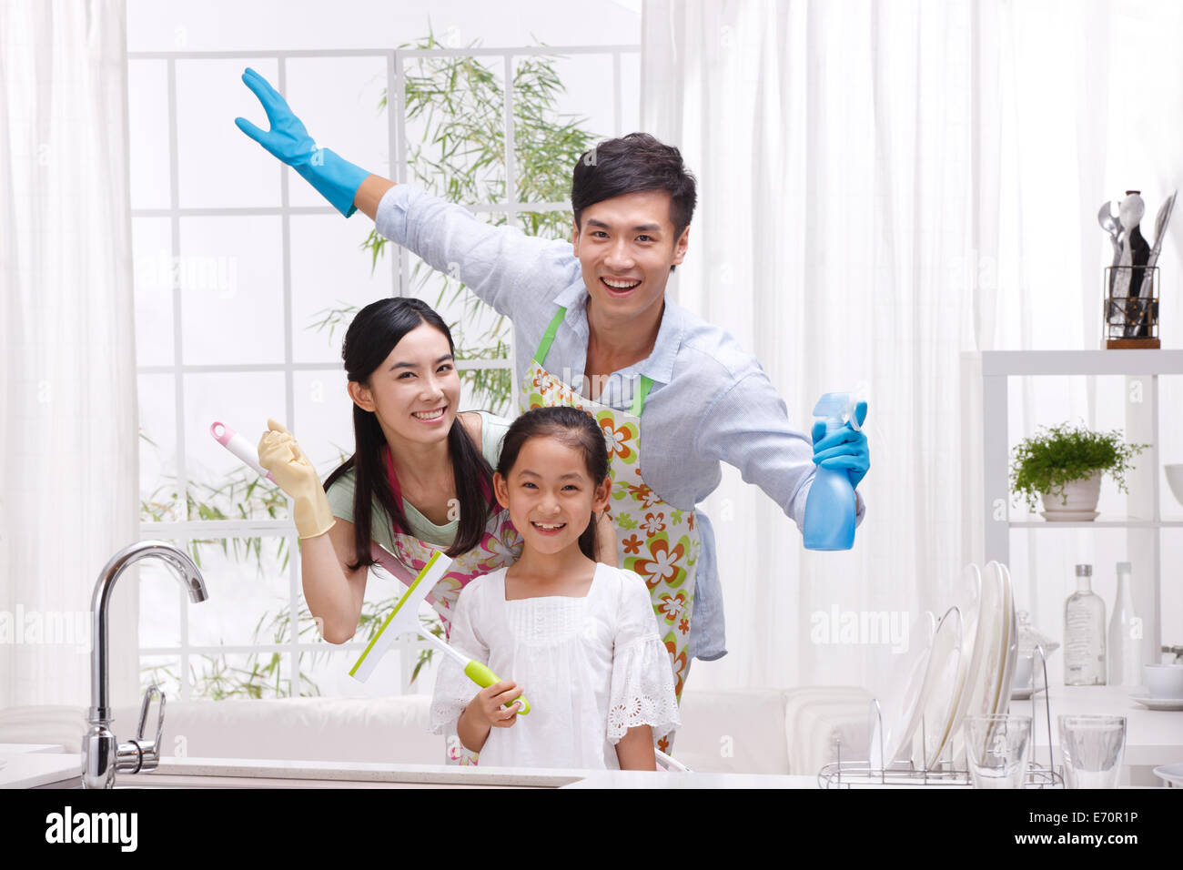 Family cleaning room Stock Photo - Alamy