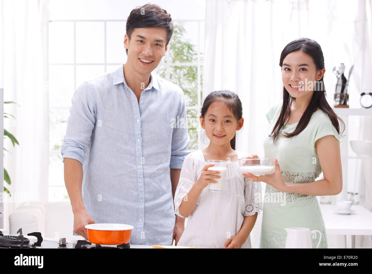 Family cooking breakfast in kitchen Stock Photo - Alamy