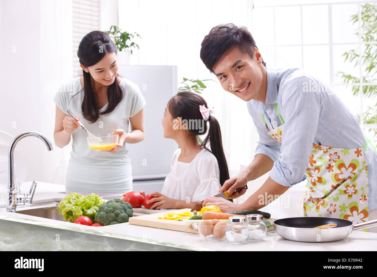 Family cooking in kitchen Stock Photo - Alamy