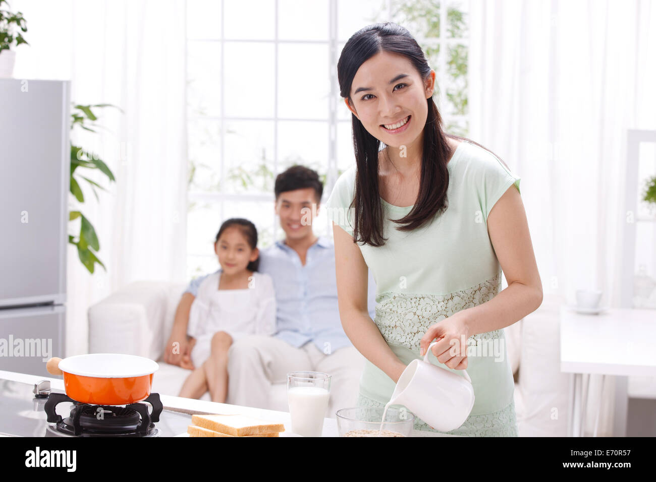 Family cooking in kitchen Stock Photo - Alamy