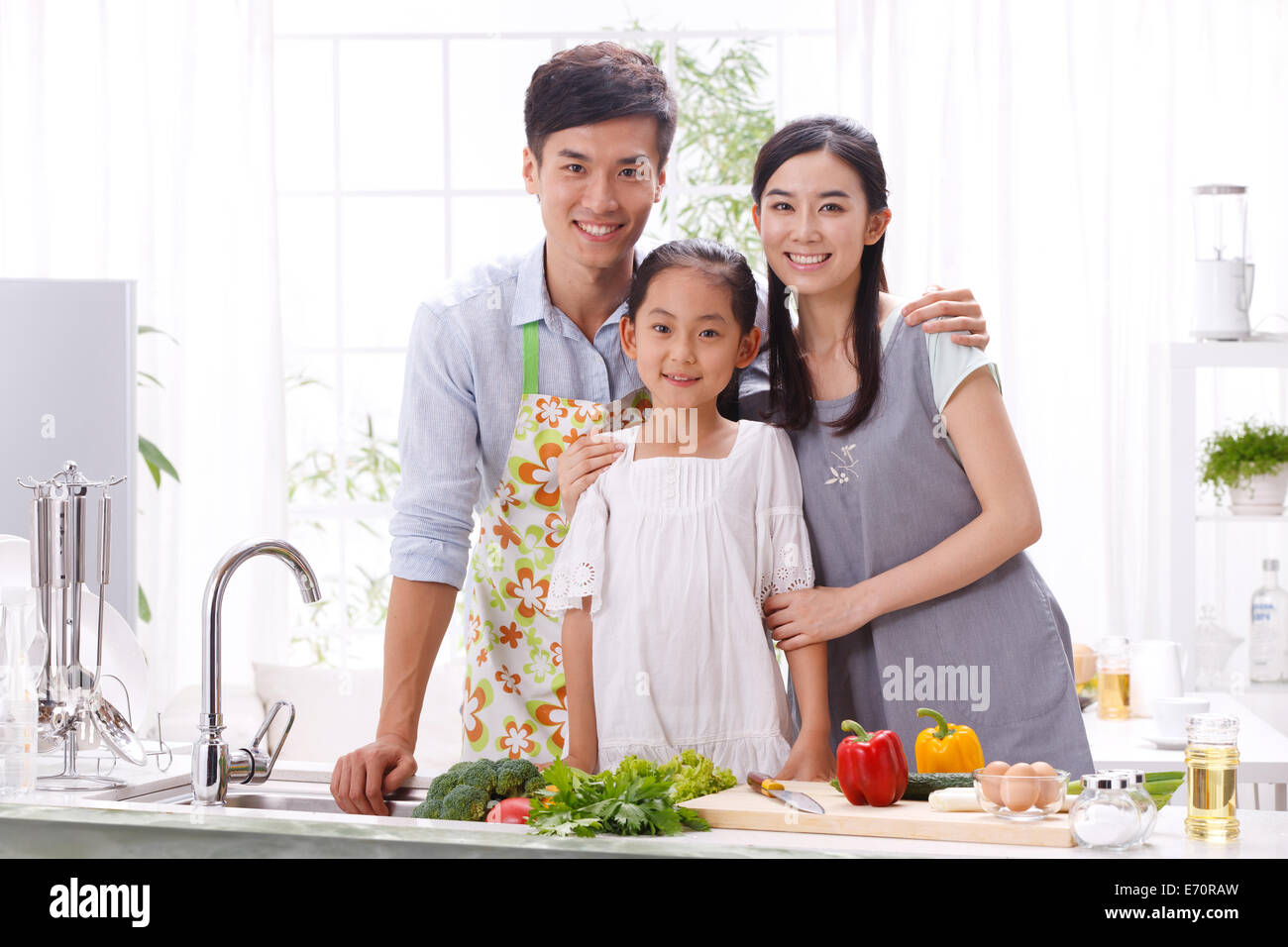 Family cooking in kitchen Stock Photo - Alamy