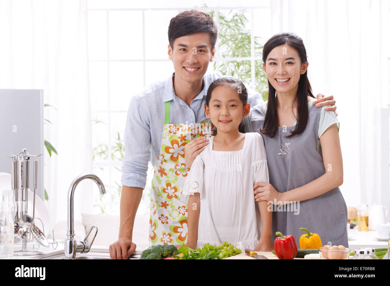 Family in kitchen Stock Photo - Alamy