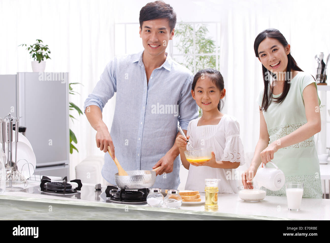 Family cooking in kitchen Stock Photo - Alamy