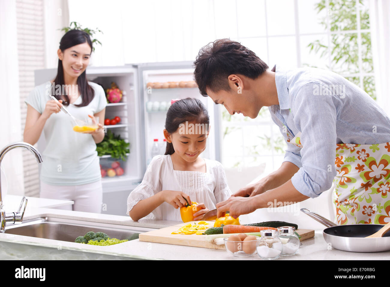 Family cooking in kitchen Stock Photo - Alamy