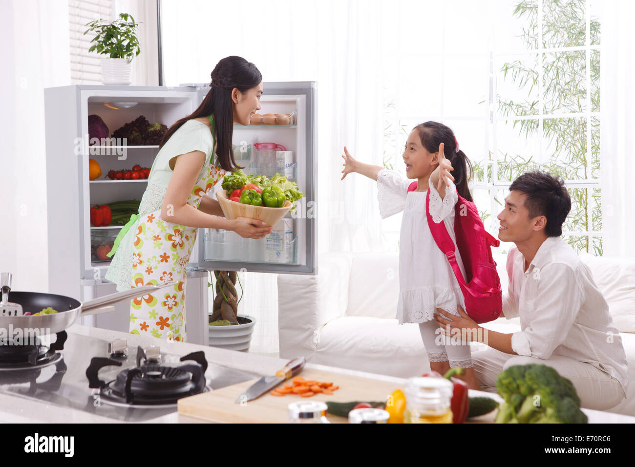 Family in kitchen Stock Photo - Alamy