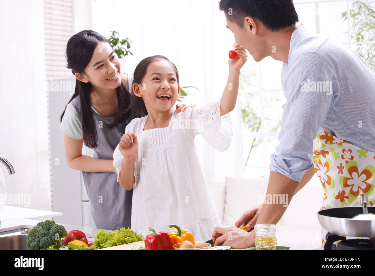 Family cooking in kitchen Stock Photo - Alamy