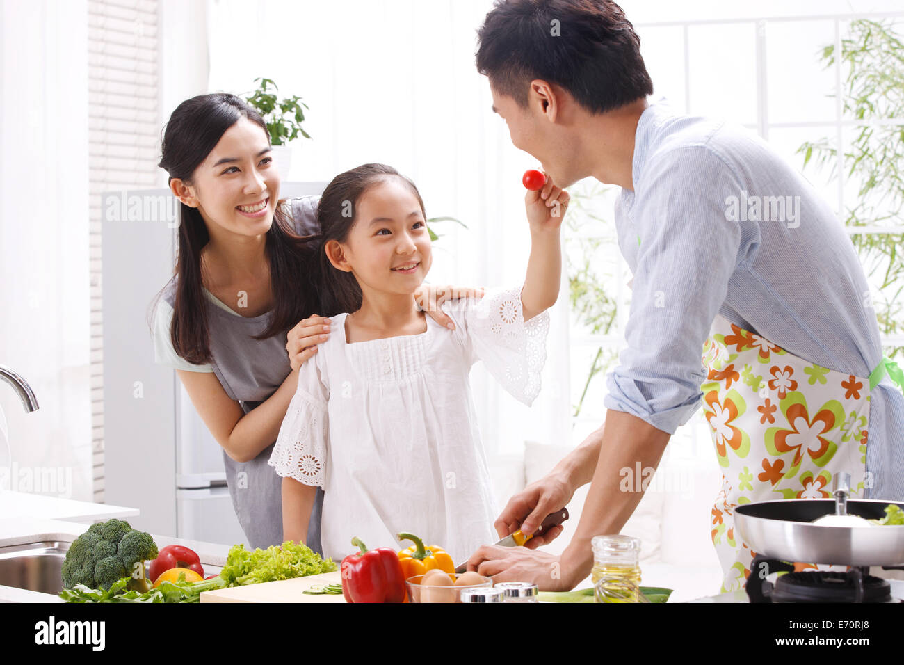 Family cooking in kitchen Stock Photo - Alamy