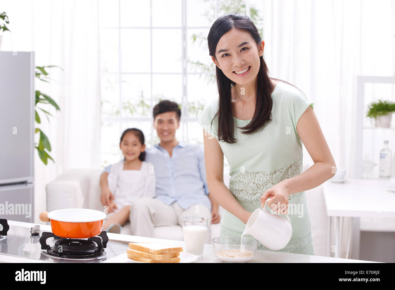 Family eating breakfast on sofa hi-res stock photography and images - Alamy