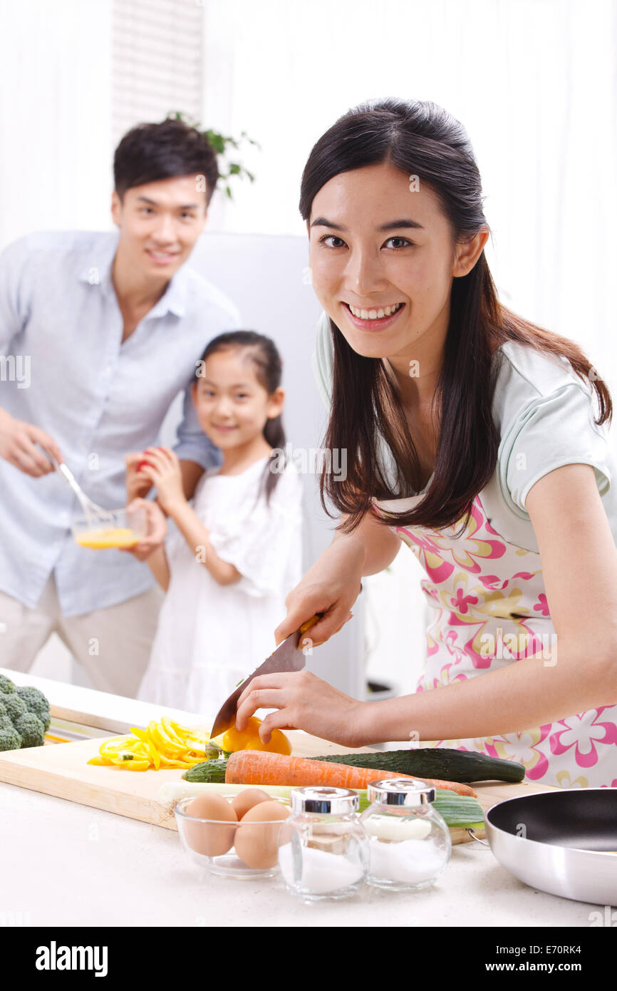 Family cooking in kitchen Stock Photo - Alamy
