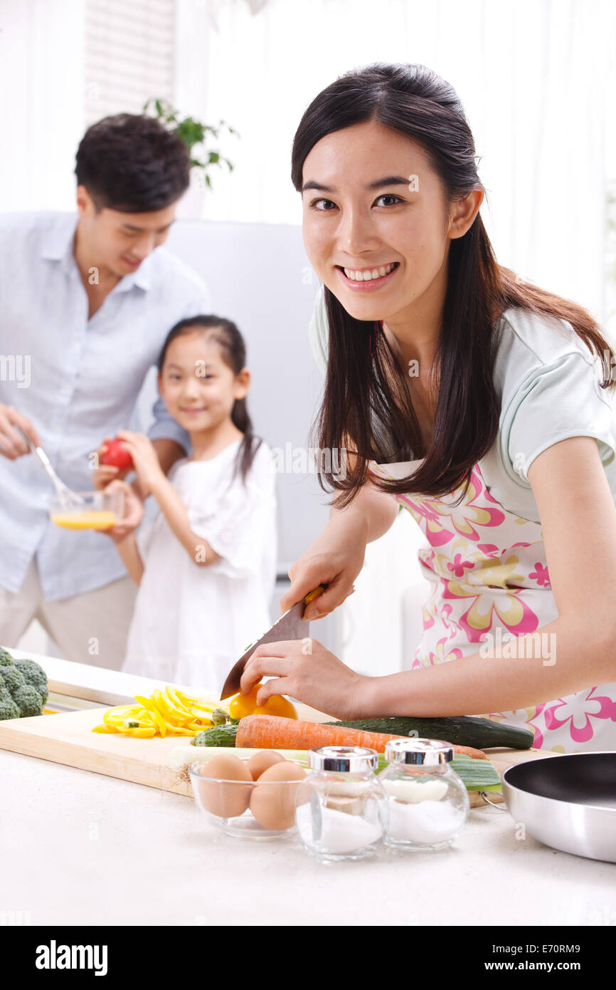 Family cooking in kitchen Stock Photo - Alamy