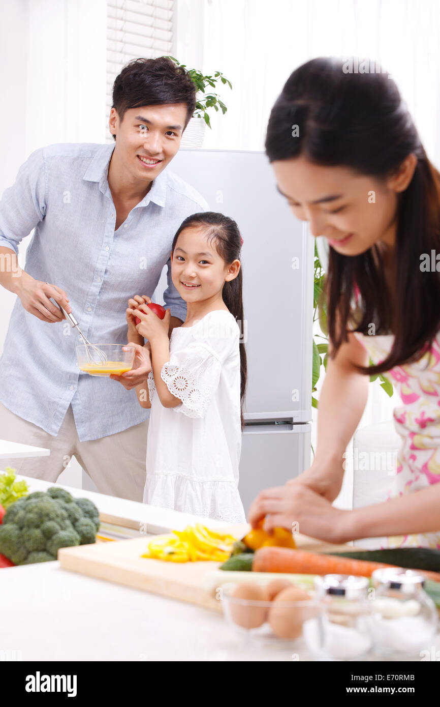 Family cooking in kitchen Stock Photo - Alamy
