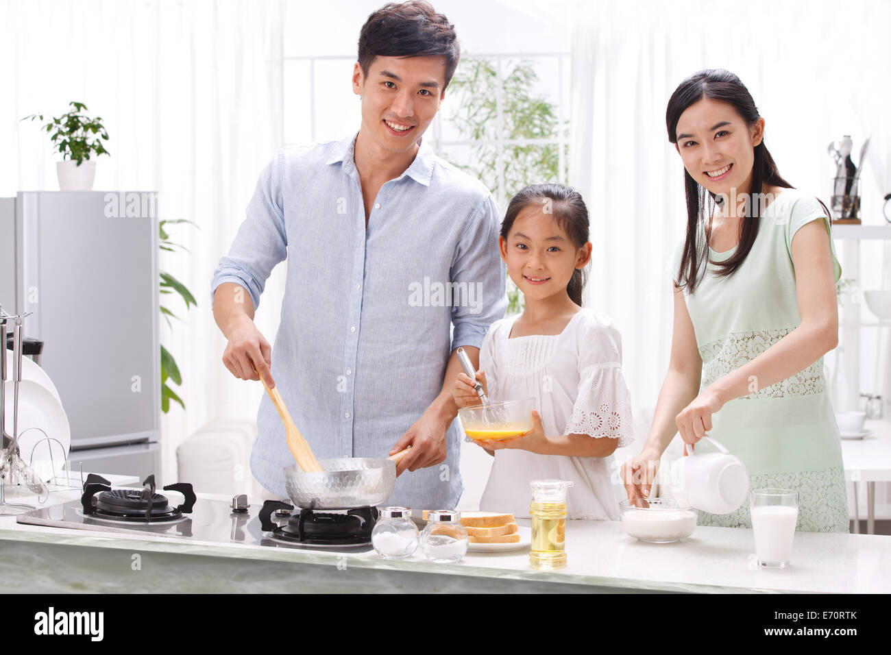 Family cooking in kitchen Stock Photo - Alamy