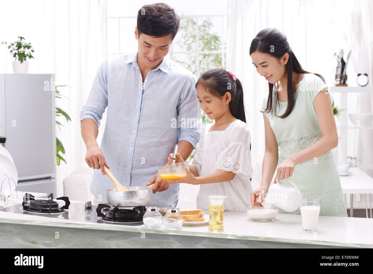 Family cooking in kitchen Stock Photo - Alamy