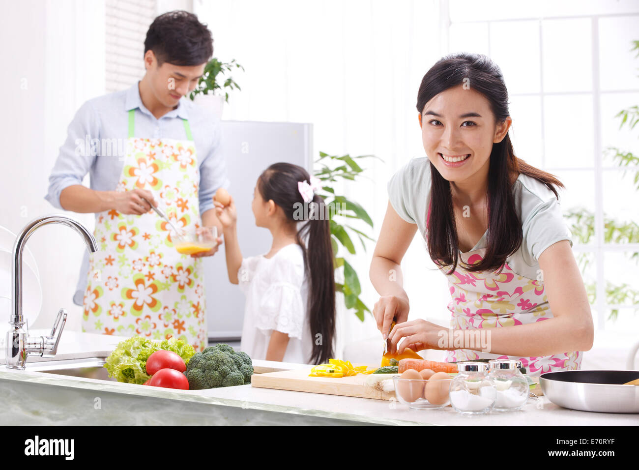 Family cooking in kitchen Stock Photo - Alamy