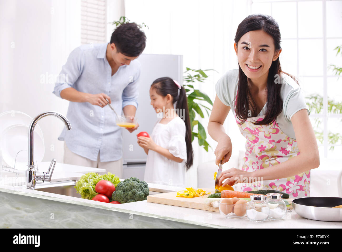 Family cooking in kitchen Stock Photo - Alamy
