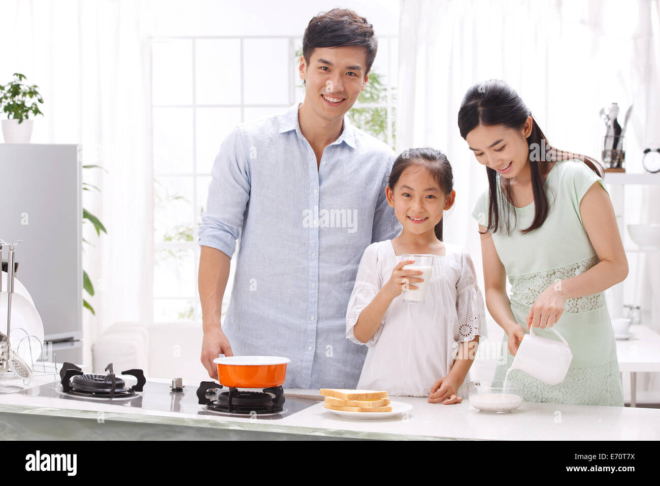Family cooking in kitchen Stock Photo - Alamy