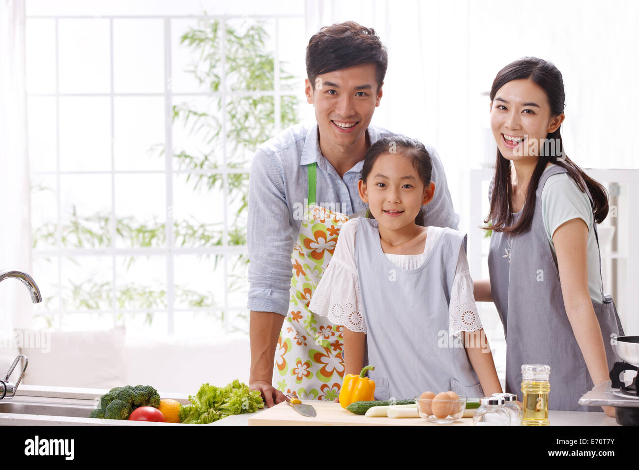 Family cooking in kitchen Stock Photo - Alamy