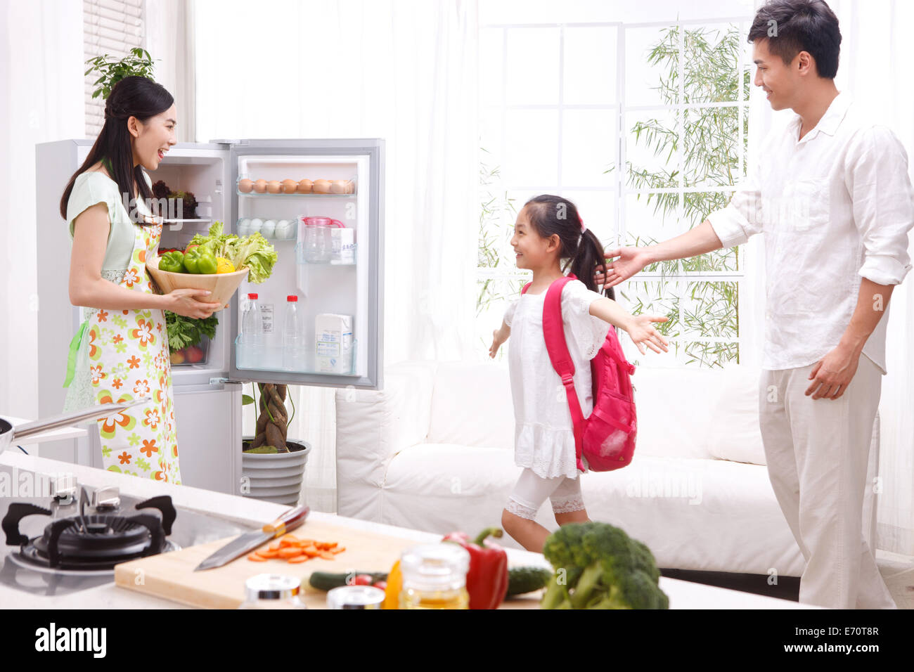 Family in kitchen Stock Photo - Alamy