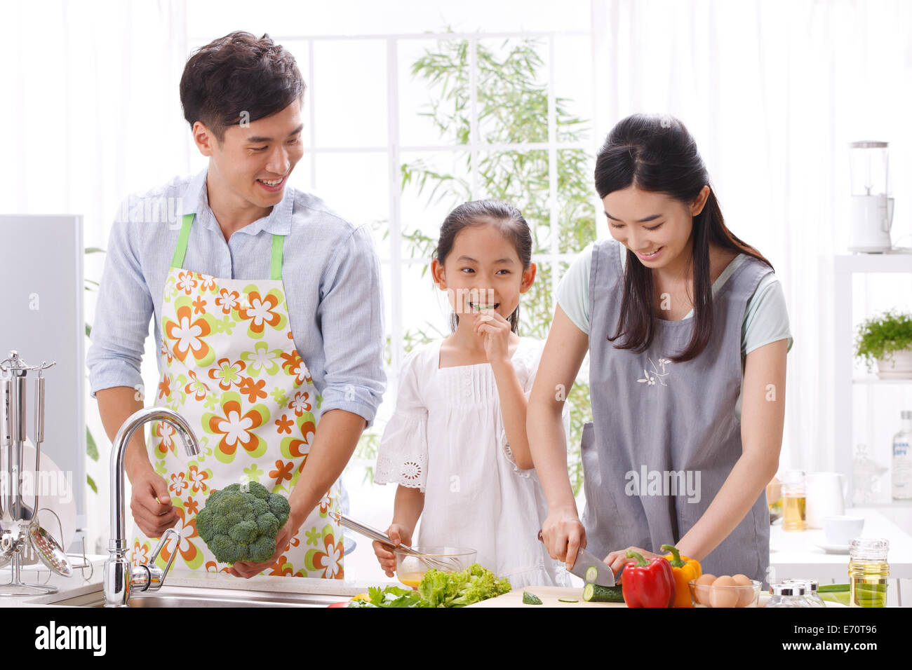 Family cooking in kitchen Stock Photo - Alamy