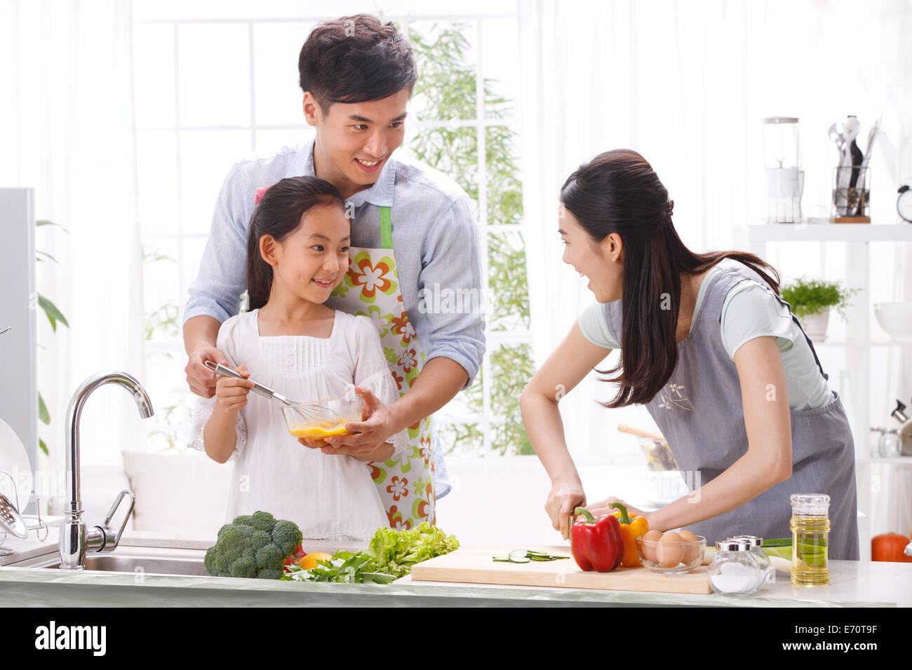 Family cooking in kitchen Stock Photo - Alamy