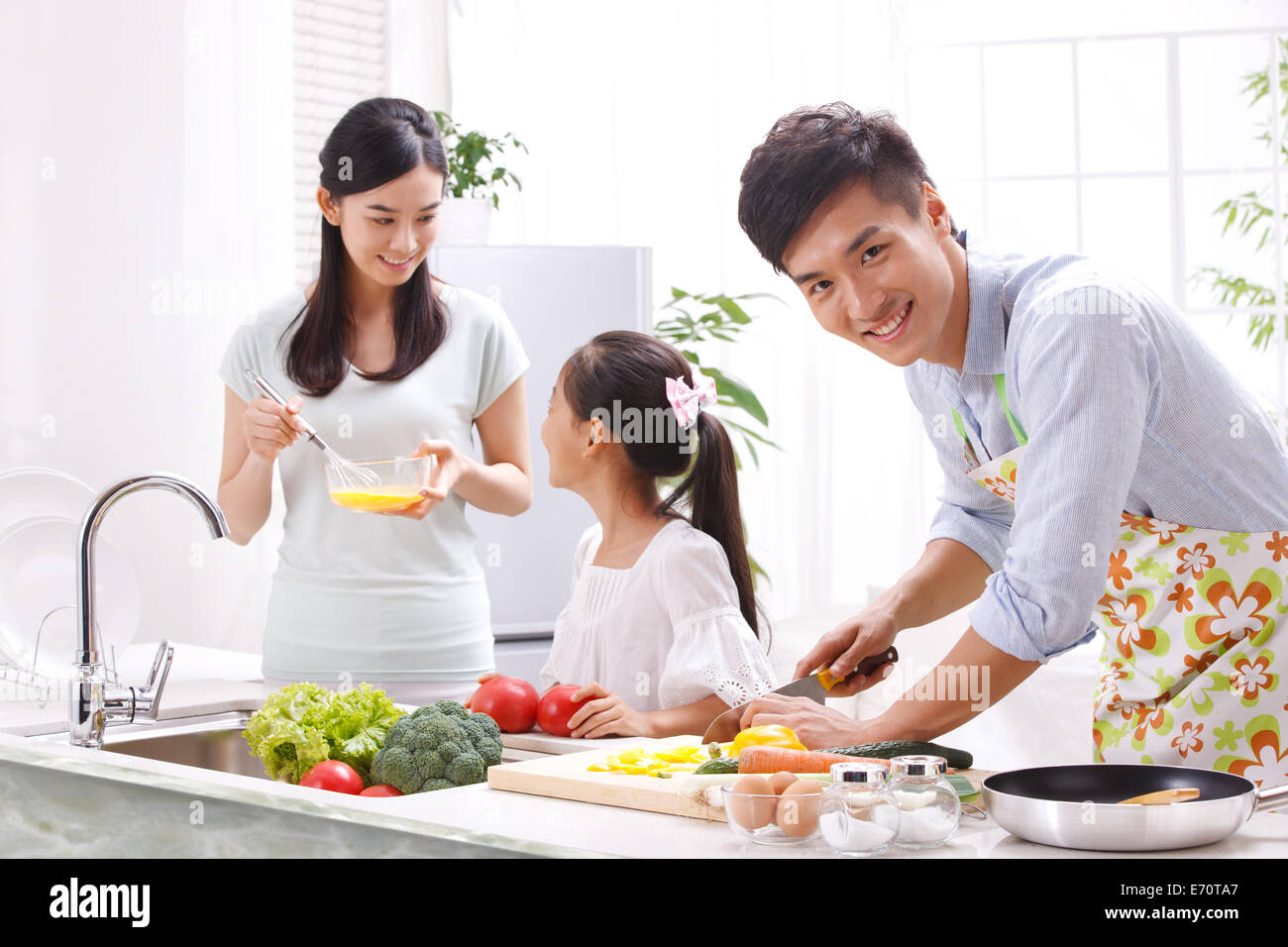 Family cooking in kitchen Stock Photo - Alamy
