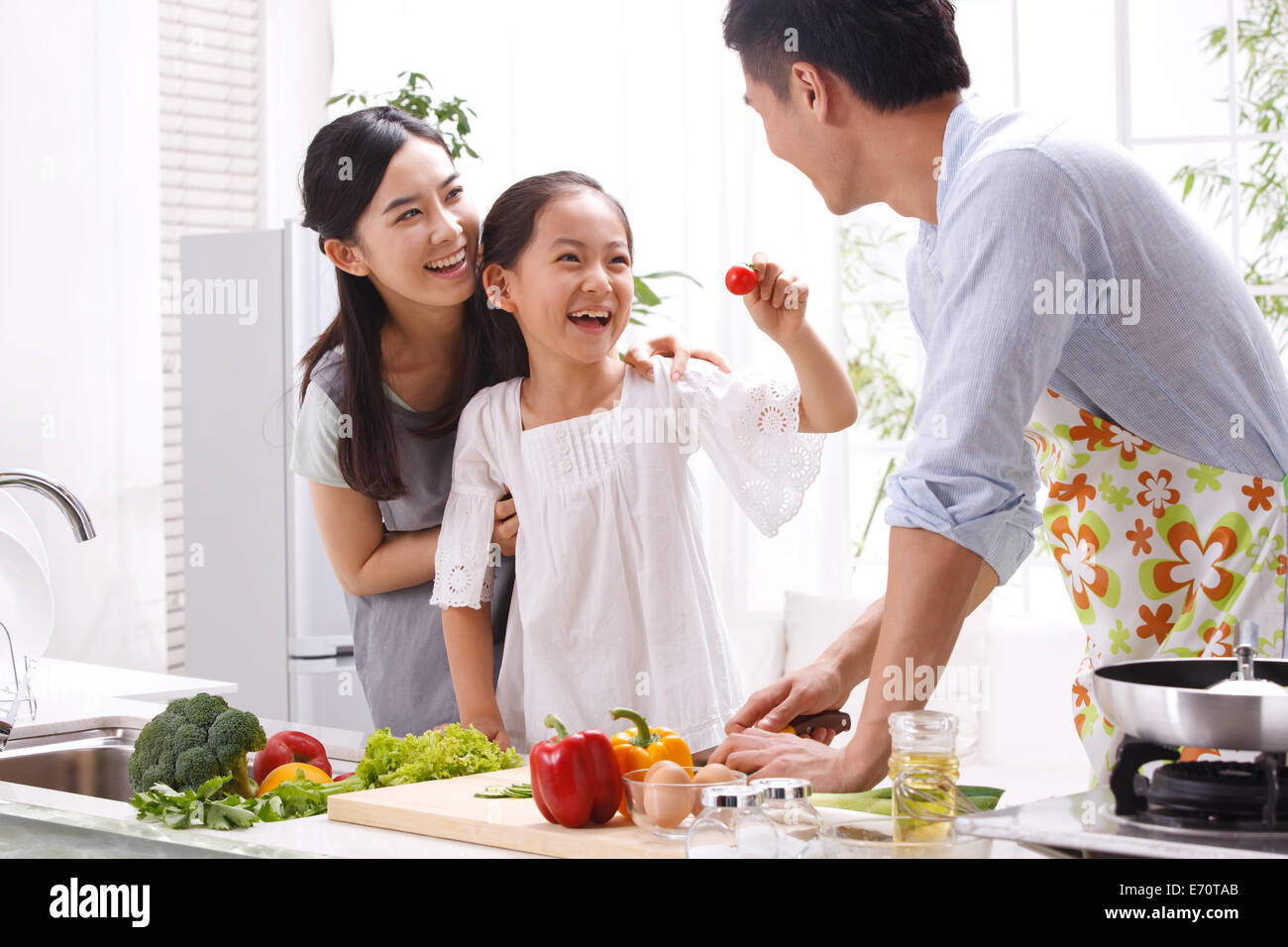 Family cooking in kitchen Stock Photo - Alamy