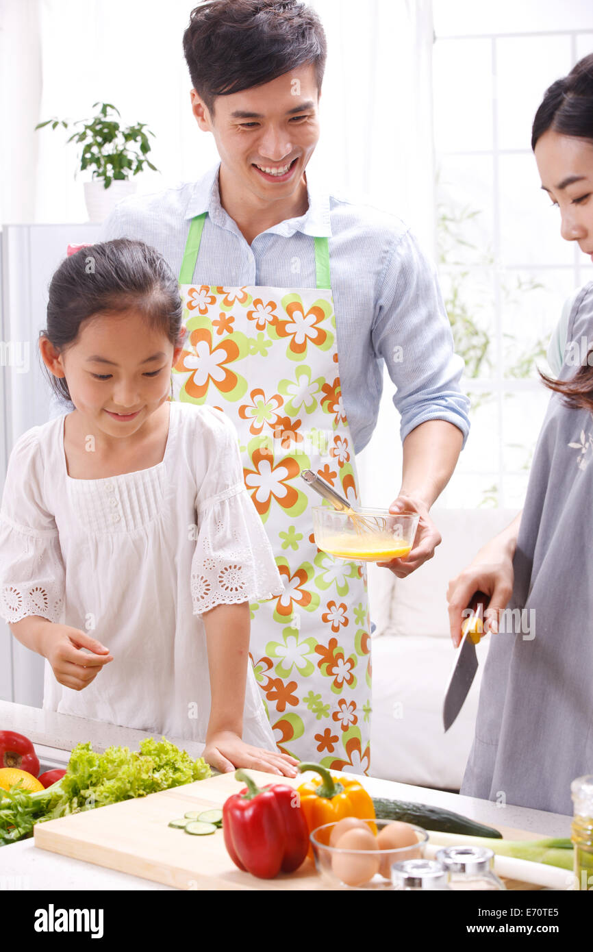 Family cooking in kitchen Stock Photo - Alamy