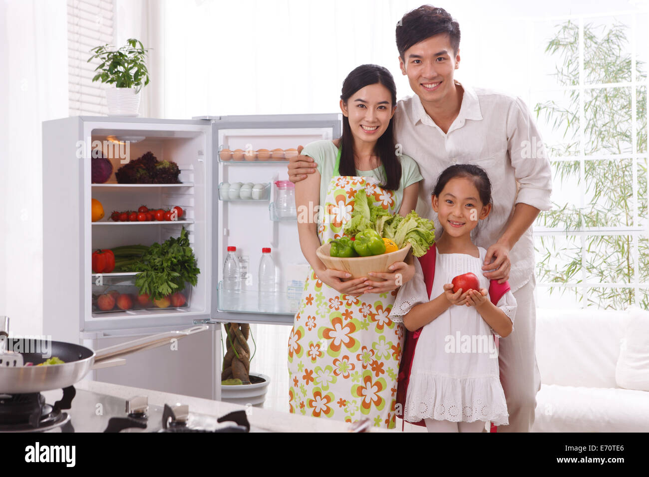 Family cooking in kitchen Stock Photo - Alamy