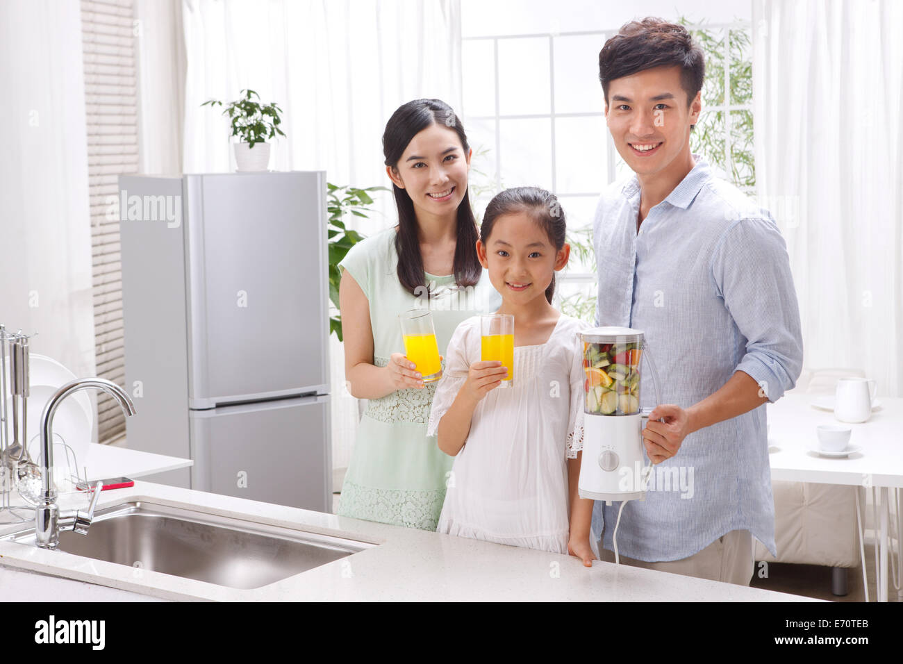 Family cooking in kitchen Stock Photo - Alamy