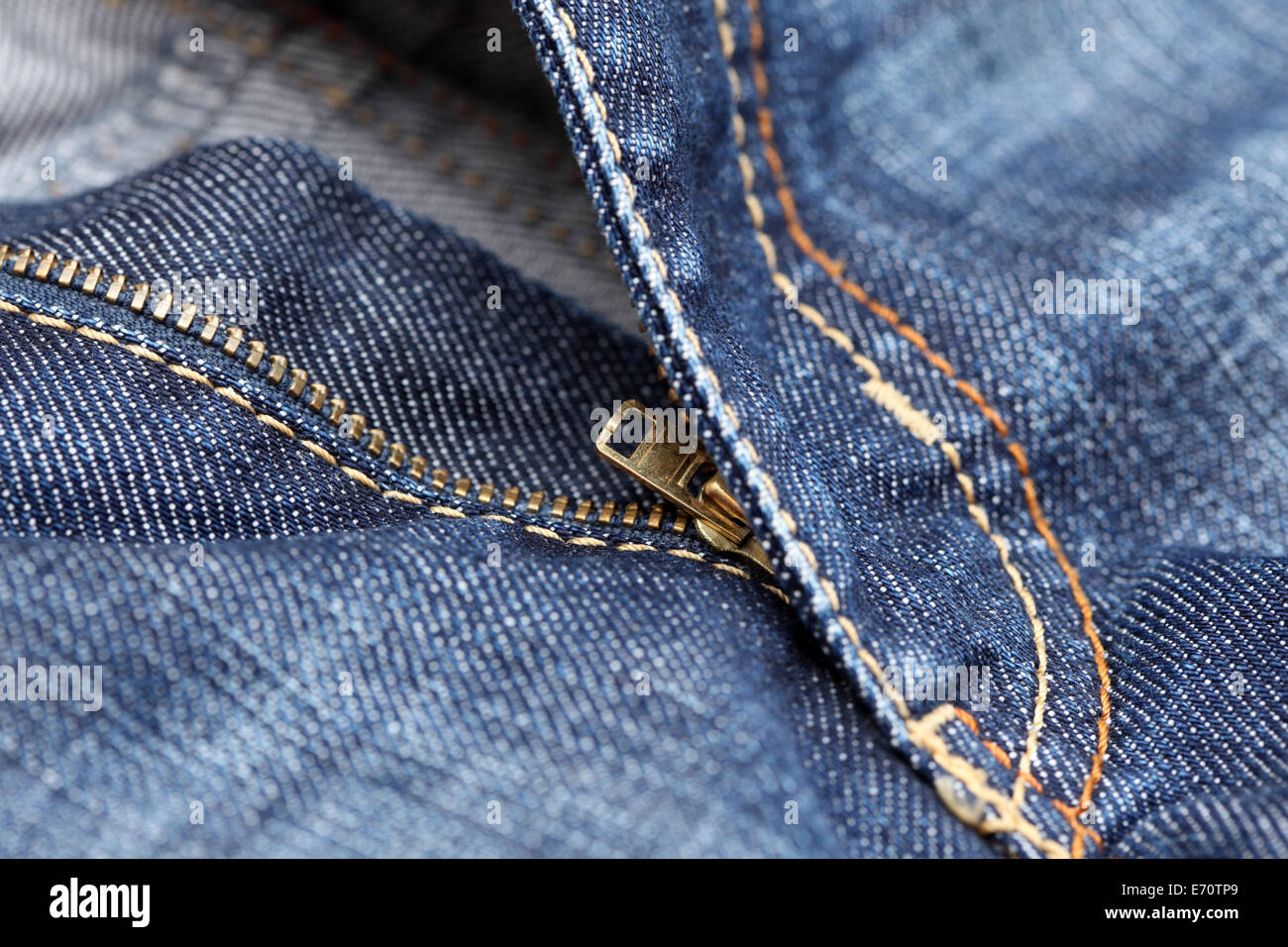 Zipper on blue jeans. Closeup Stock Photo - Alamy